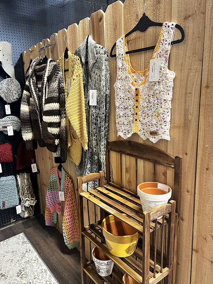 Handcrafted sweaters and vests hanging like textile art—because nothing says "I'm interesting" like vintage crochet from another era.