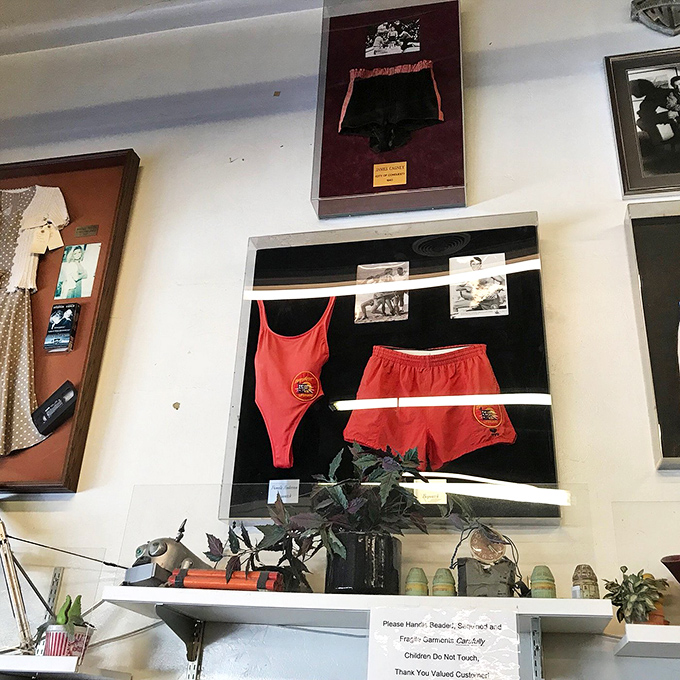 Wall-mounted memorabilia tells tales of productions past. These framed pieces transform shopping into a museum-worthy experience.