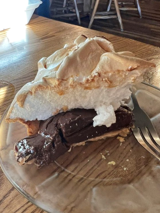 Chocolate meringue pie so tall it deserves its own ZIP code. That cloud of meringue is what dessert dreams are built on.