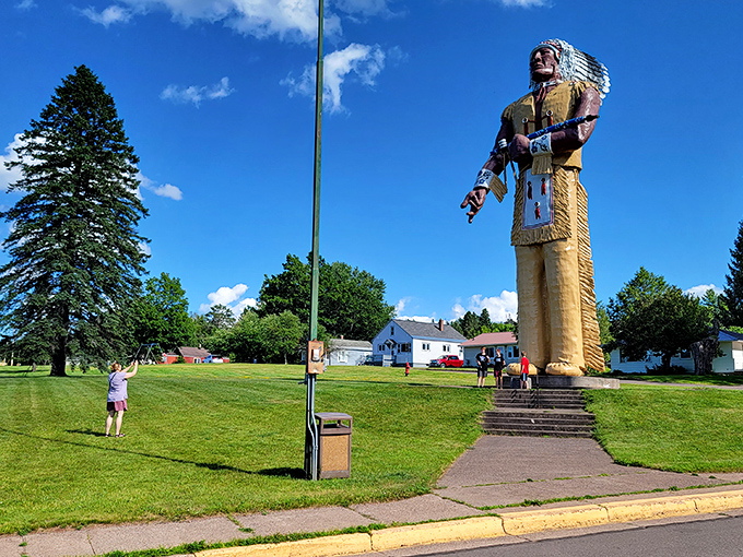 "Look up, way up!" The statue's imposing height transforms adults into wide-eyed children, necks craned in wonder at this Upper Peninsula giant.