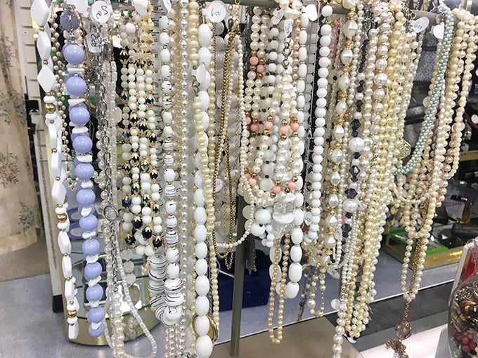 Pearl strands and beaded treasures hanging like elegant stalactites in a cave of affordable luxury. Grandma's favorites meet contemporary style.