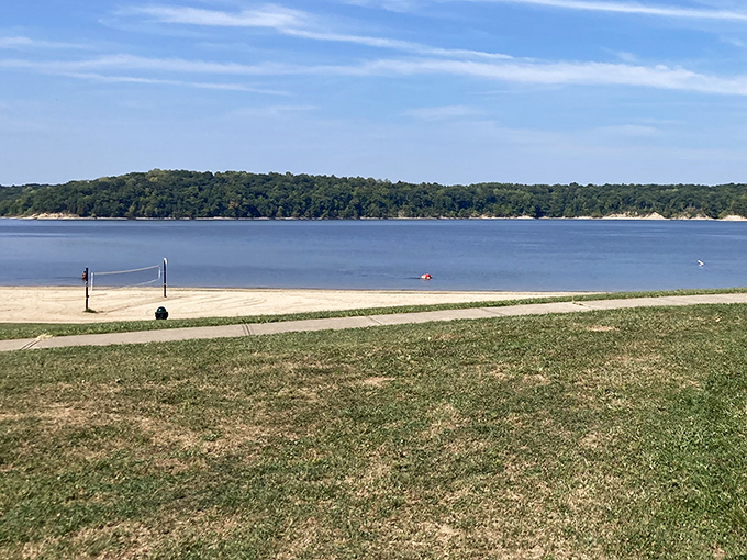 Beach volleyball, anyone? The net stands ready while the lake beckons those who prefer swimming to spiking.