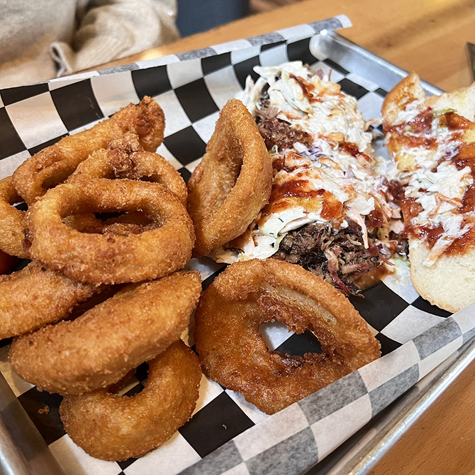 Onion rings with the perfect crunch-to-give ratio alongside a sandwich that's not messing around. This is what lunch dreams are made of.