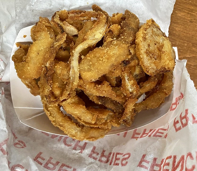 These aren't just onion rings; they're golden halos of happiness, crispy enough to make even angels jealous of mere mortals.