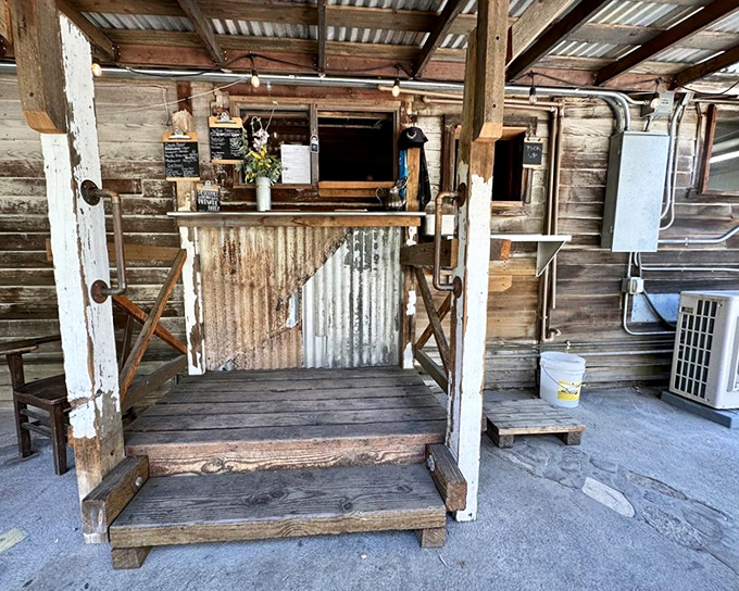 This isn't just an ordering window&mdash;it's a portal to happiness. The weathered wood and corrugated metal speak to simpler times when food was honest.
