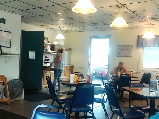 Another angle reveals the cozy interior where stone meets comfort and every meal feels like home.