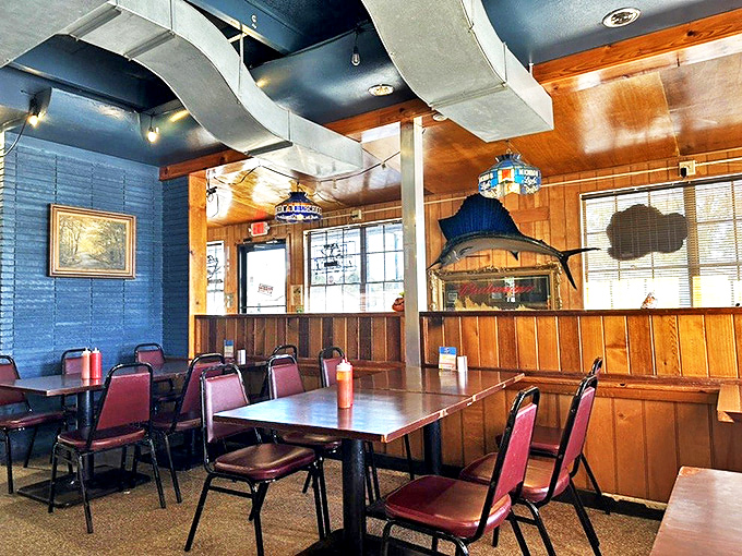 The open kitchen concept lets you witness culinary magic happening while maritime treasures watch overhead.