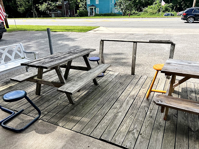 Weather-worn picnic tables tell stories of countless summer evenings, first dates, and the kind of conversations that only happen over great food.