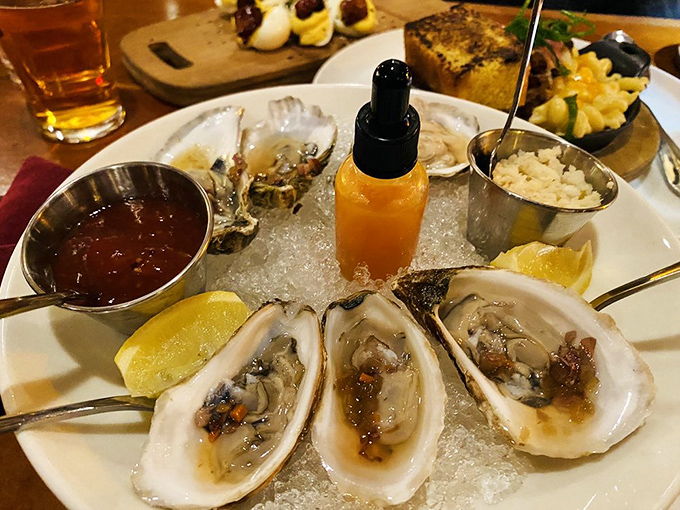 Oysters presented with the reverence they deserve. That dropper bottle of sauce is the jewelry these briny treasures need to really shine.