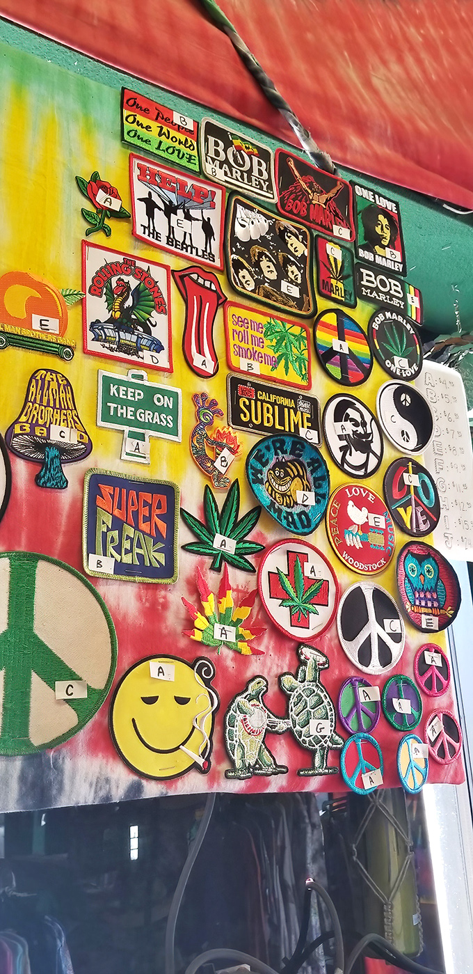 The wall of patches reads like a time capsule of counterculture, where Bob Marley meets The Beatles in patch paradise.