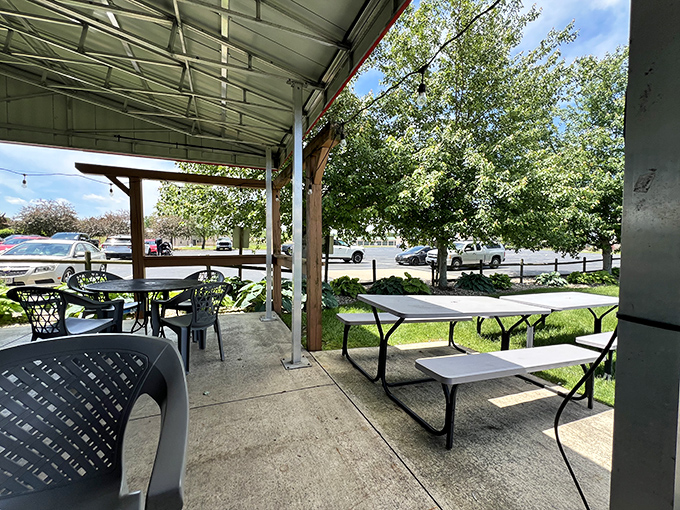 A covered patio that beckons with the promise of fresh air and fresher BBQ. Nature and nurture in perfect harmony. 