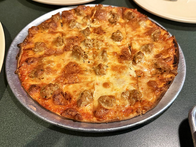 This pizza isn't trying to be Italian&mdash;it's proudly St. Louis style with its thin crust and melty Provel cheese. Midwestern magic on a pan.