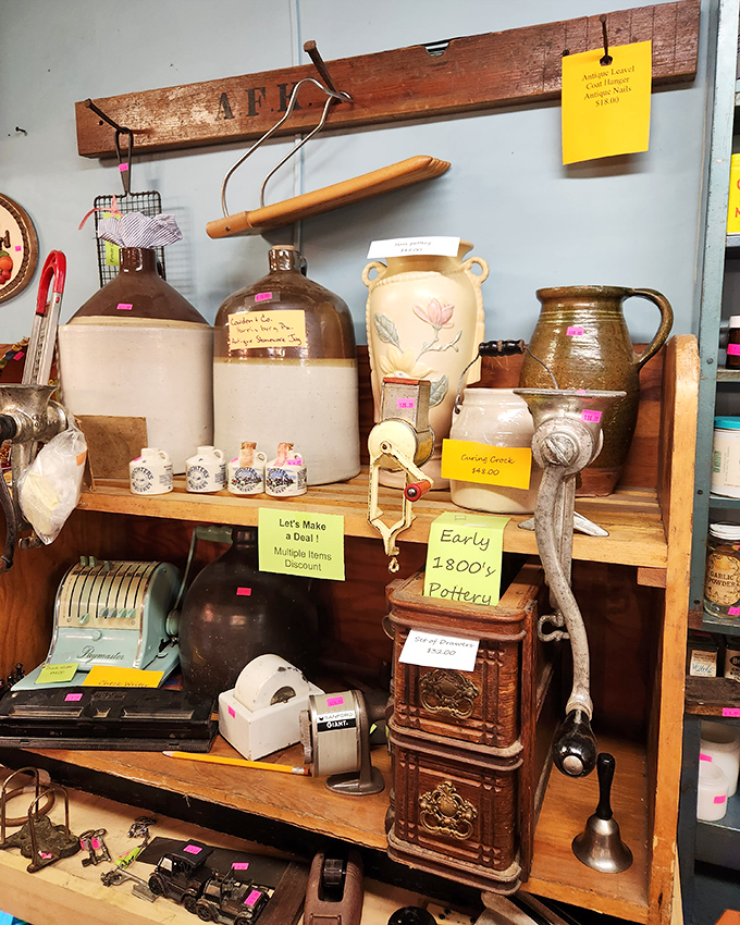 Early American pottery stands at attention, waiting for new homes. These sturdy vessels have survived centuries and still look ready to serve.