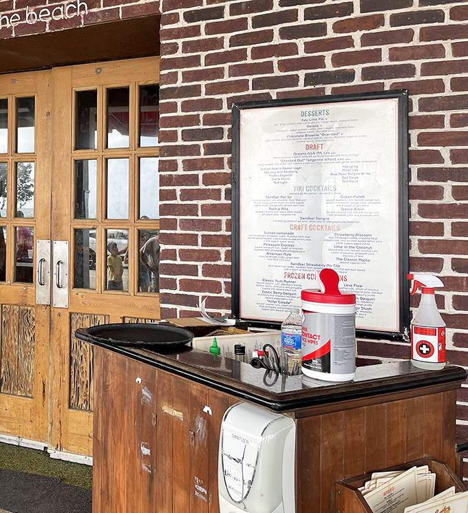 The entrance speaks volumes: brick walls, wooden doors, and a drinks menu that promises good times ahead. Simple pleasures done right.