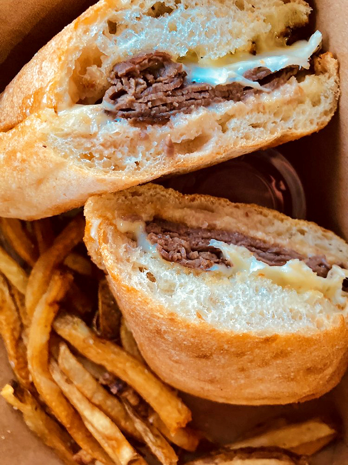 The cross-section of this roast beef sandwich reveals the architectural genius behind it&mdash;tender meat, melted cheese, and bread that knows its purpose.