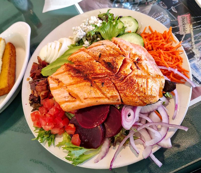 A salmon salad that makes "eating healthy" feel like cheating. Every colorful component plays its part in this perfectly orchestrated plate.