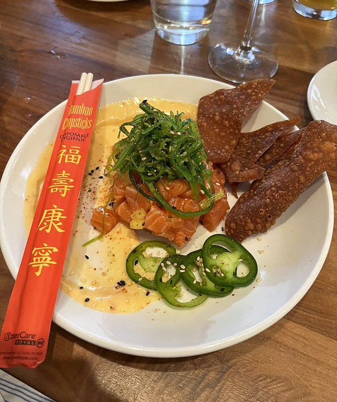 This salmon poke is having a moment with jalape&ntilde;os, sesame crackers, and a sauce that makes everything play nicely together.