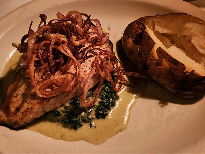 This isn't just salmon&mdash;it's a love letter to simplicity. Perfectly seared fish resting on wilted greens with crispy shallots that add textural jazz hands.