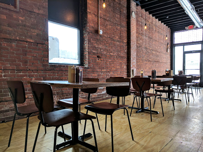Empty tables waiting for the lunch rush &ndash; like calm before the delicious storm of barbecue enthusiasts.