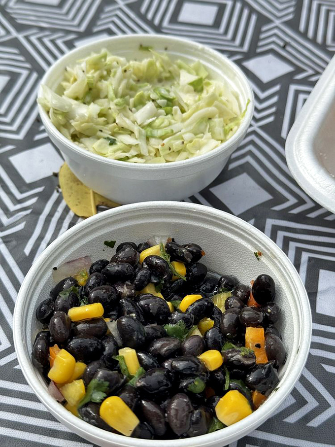 Fresh coleslaw and black bean salad&mdash;proof that sides aren't afterthoughts here but supporting actors deserving of their own standing ovation.