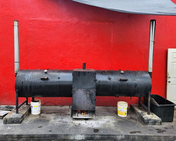 This isn't just equipment—it's the heart of the operation. The massive smoker where magic happens low and slow, transforming tough cuts into tender treasures.