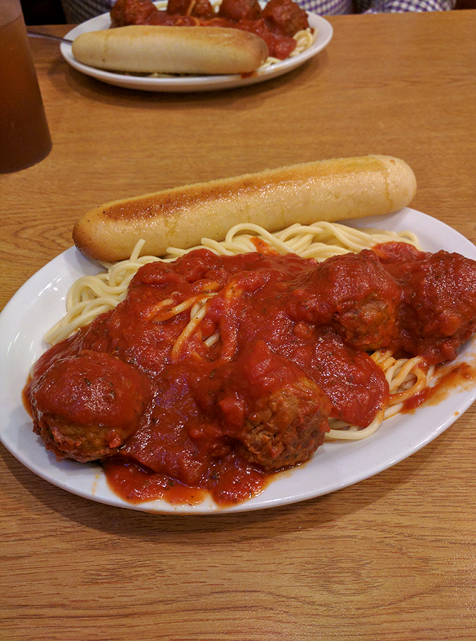 Spaghetti and meatballs with a side of garlic bread&mdash;proof that Italian-American classics taste best in unpretentious diners with paper napkins.