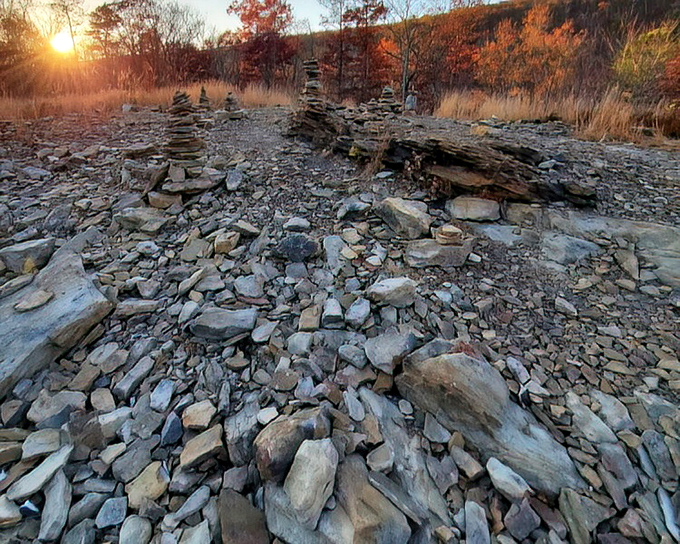 Rock stacking: part meditation, part environmental art, and entirely hypnotic against the backdrop of a Pennsylvania sunset.