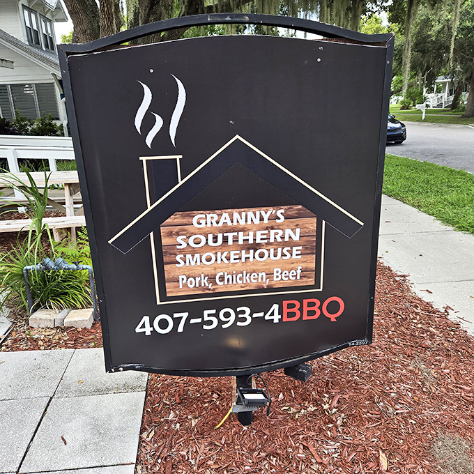 A sign that promises more than directions—it's pointing you toward smoke-ring nirvana. Follow it like you're chasing happiness itself.