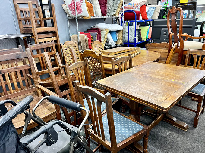 A gathering of wooden chairs and tables that have witnessed thousands of family dinners now patiently waiting for their next chapter of mealtime memories.