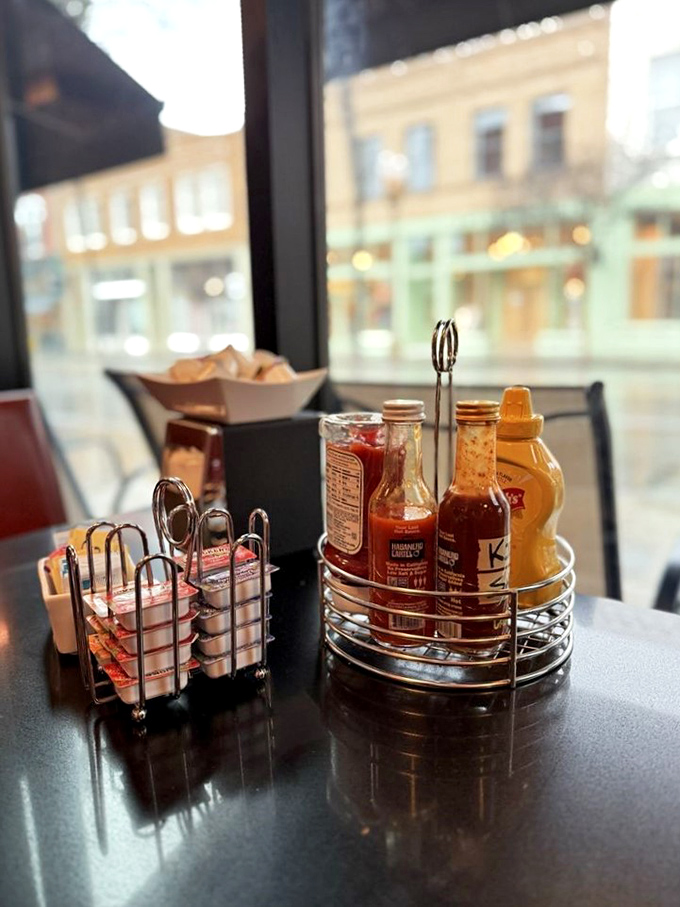 The condiment caddy&mdash;civilization's greatest achievement. Hot sauce, syrup, and jam await your culinary decisions.