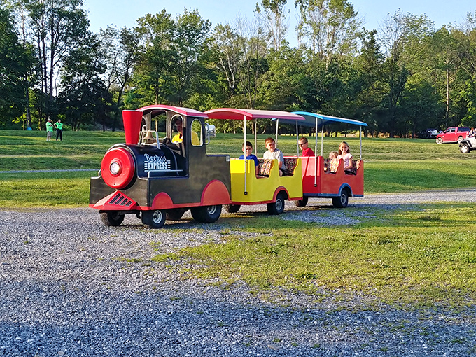 The little locomotive that could! Becky's colorful train ride circles the grounds, delighting youngsters before showtime with its cheerful chug-a-chug.