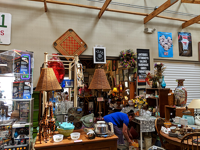Lampshades and treasures and chairs, oh my! This antique corner feels like rummaging through your coolest grandparent's attic&mdash;but everything's for sale.