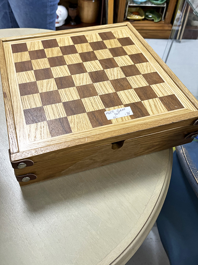 This handcrafted wooden chess set has witnessed countless strategic battles, each square holding the ghosts of games past.