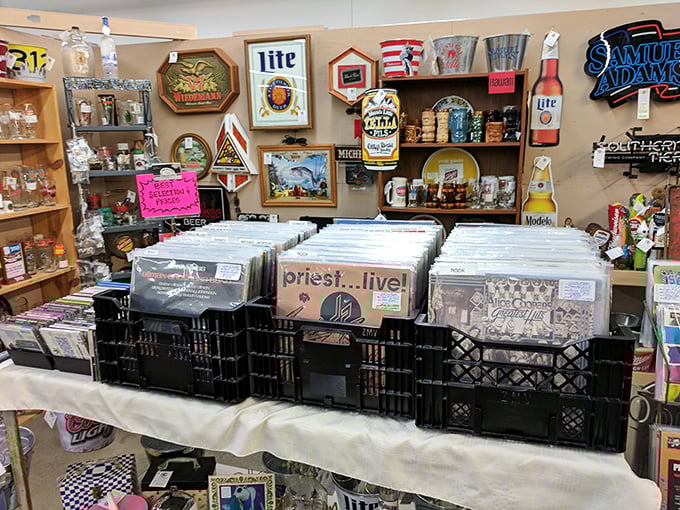 Vinyl crates flanked by beer memorabilia—the perfect man cave starter kit for someone looking to relive their glory days through music.