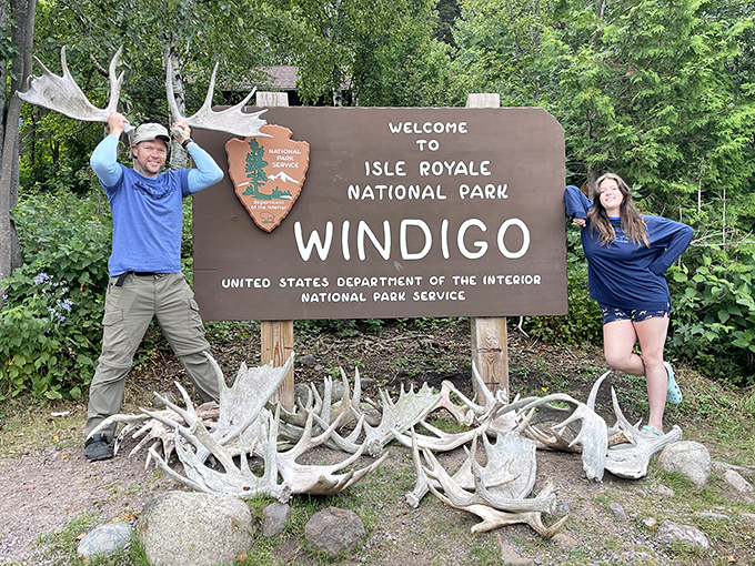 Finding joy in the wild places. The collection of moose antlers at Windigo entrance serves as both natural decoration and conversation starter for excited park visitors.