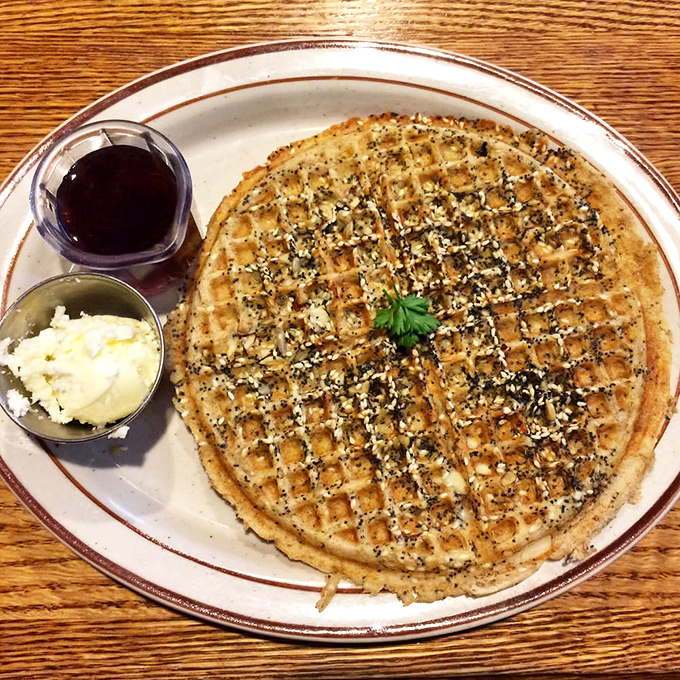 This isn't just a waffle, it's an architectural achievement with perfect grid work. The butter and syrup on standby, ready for their supporting roles.