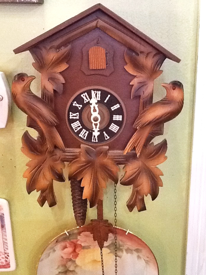 Intricately carved cuckoo clock featuring wooden birds and foliage – a masterpiece of Black Forest craftsmanship rescued from obscurity.