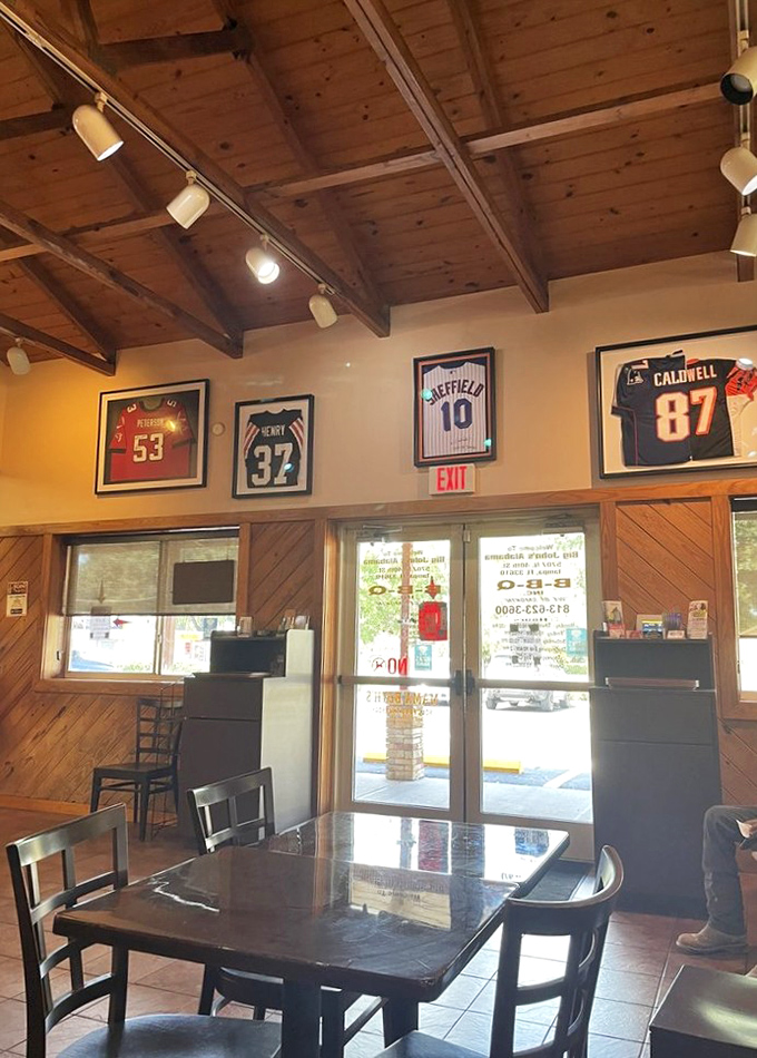 Framed photographs and memorabilia tell silent stories while diners create new ones over plates of exceptional barbecue.