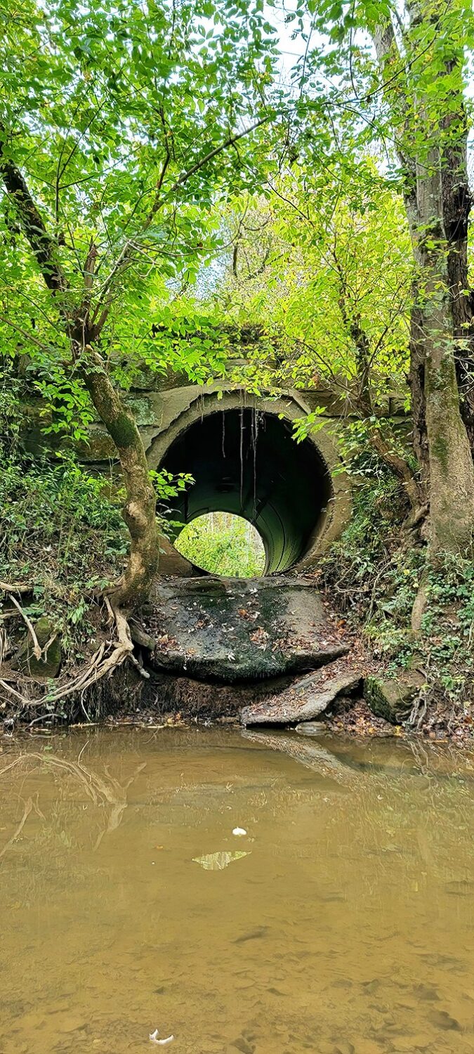 Engineering from a simpler era: this drainage culvert near the bridge shows how early Ohioans managed water flow with practical solutions.