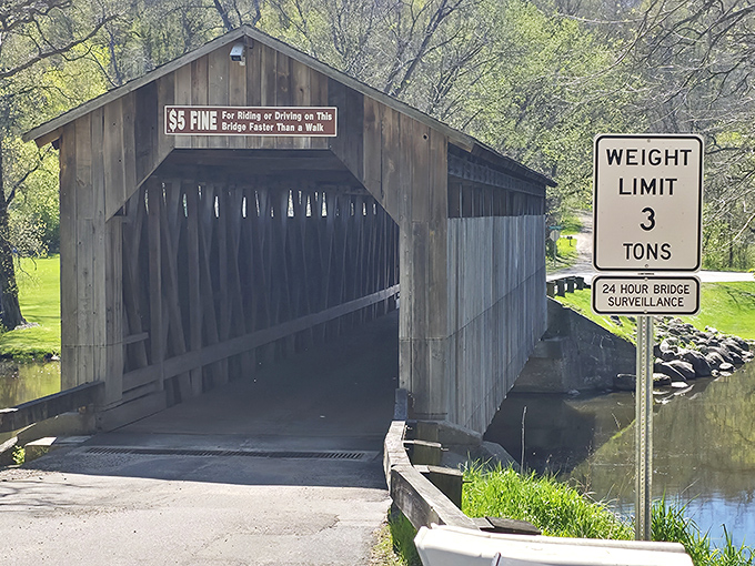 Modern safety meets historic charm with weight limit signs standing guard, ensuring this wooden treasure remains for future generations to enjoy.