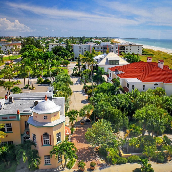 The vibrant buildings of Pass-a-Grille create a colorful backdrop for palm-lined streets just steps from the Gulf.