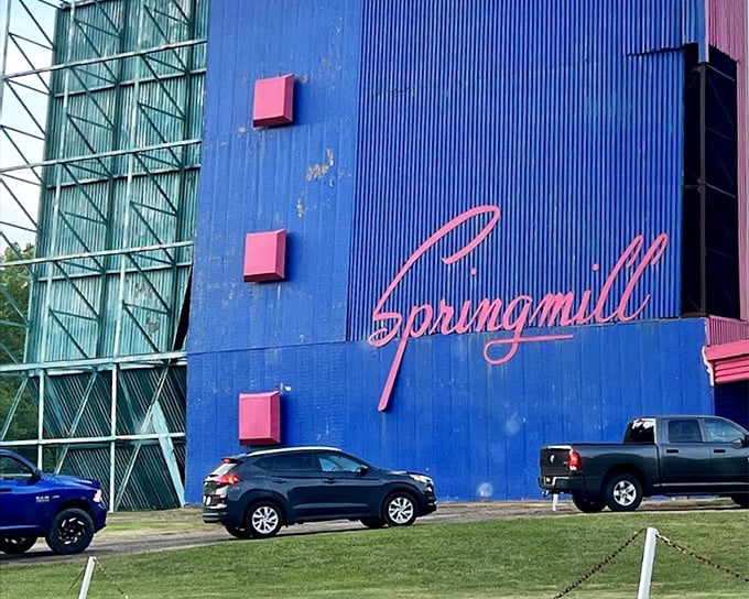 Springmill's vibrant blue facade with that classic script logo&mdash;architectural eye candy that promises entertainment before the movie even starts.