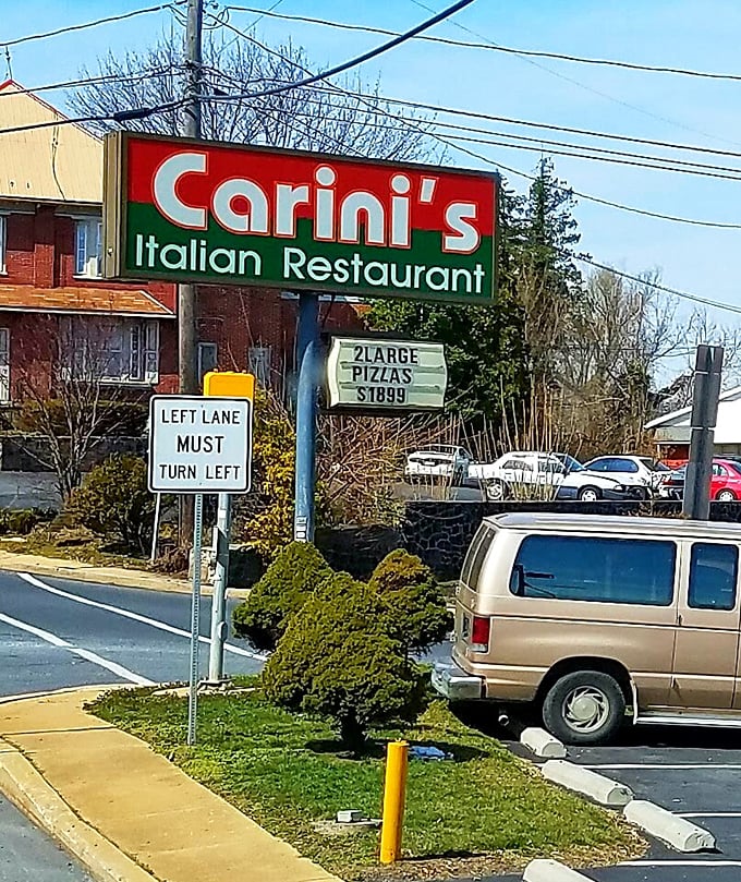 The iconic Carini's sign promises pizza deals that won't break the bank&mdash;where value isn't just a marketing term but a community commitment.