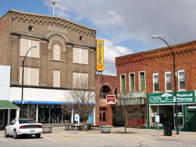 The stately brick buildings of Clinton's main street stand like sentinels of a slower time, when architecture celebrated both beauty and function.