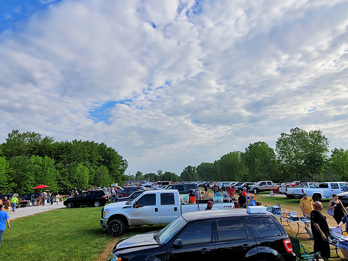 Early morning treasure hunters scan tables of possibilities. The best deals go fast when the sun is barely up!