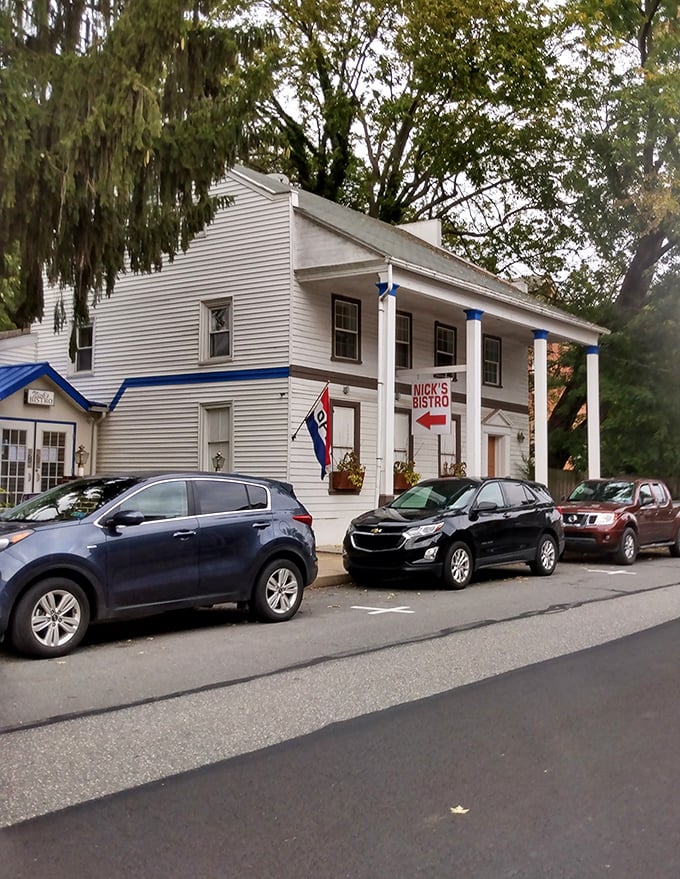 This classic white building with blue trim in Marietta houses local businesses where friendly faces know your name &ndash; and your budget.