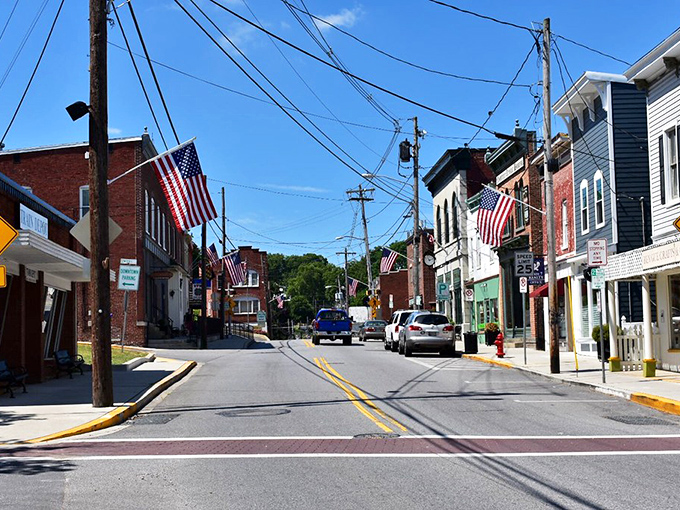 American flags flutter over a Main Street that Norman Rockwell would have painted, then framed, then painted again.
