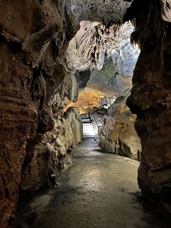 Journey into the unknown! These pathways lead visitors through chambers where every turn reveals new geological marvels.