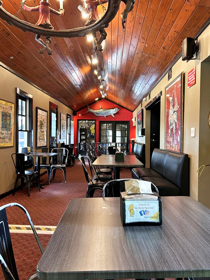 Warm wood paneling, vintage posters, and a marlin on the wall &ndash; dining room or museum of cool? You decide.