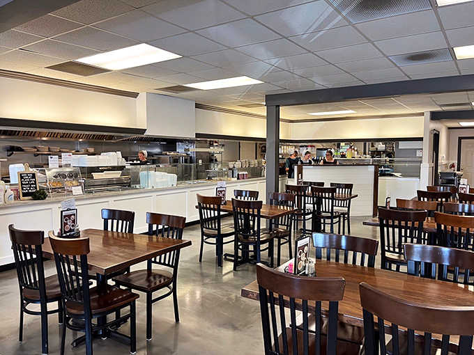 Simple wooden tables and chairs say "stay awhile" in a dining room where food, not frills, takes center stage.